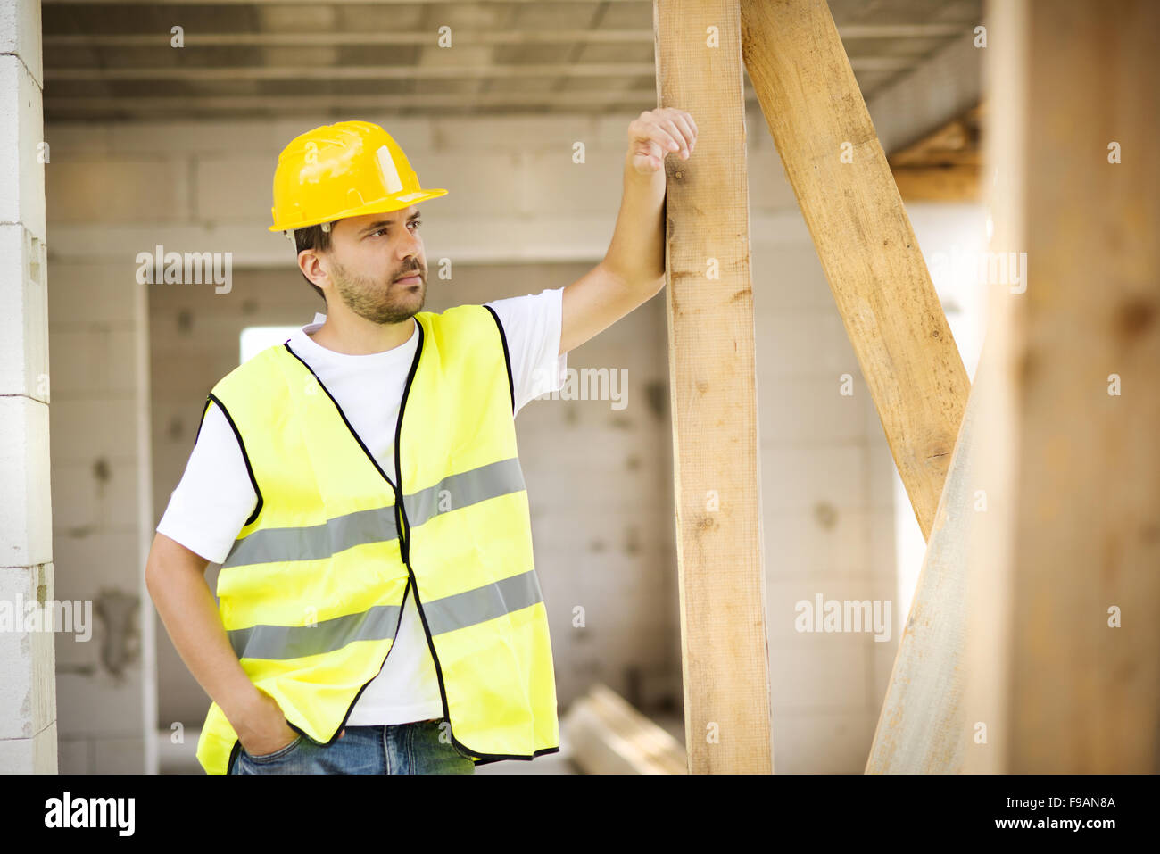Construction worker is working on new house Stock Photo - Alamy