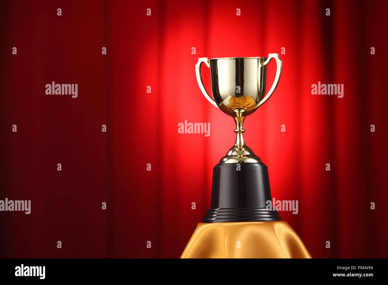 throphy in front of the red curtain Stock Photo - Alamy