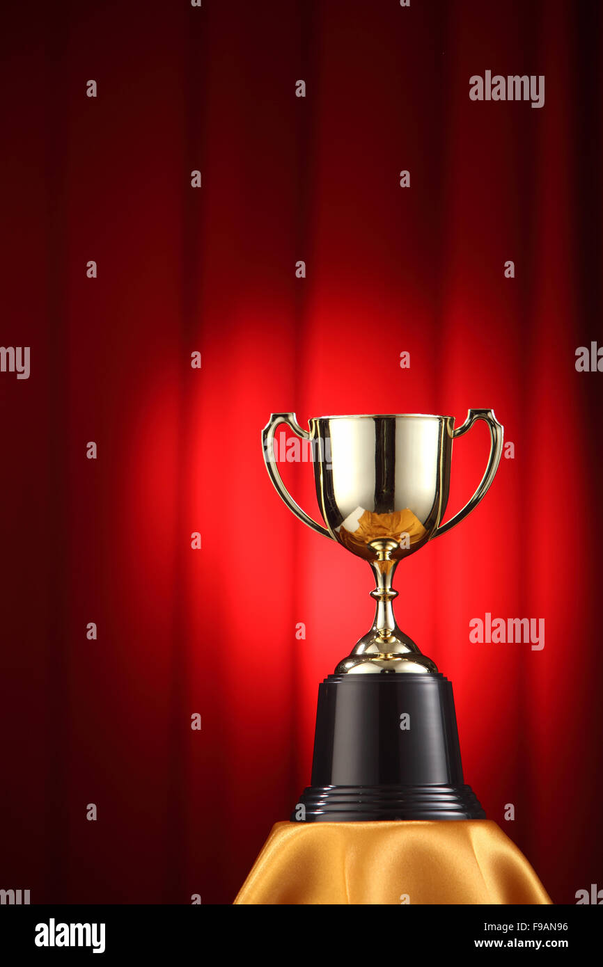 throphy in front of the red curtain Stock Photo - Alamy