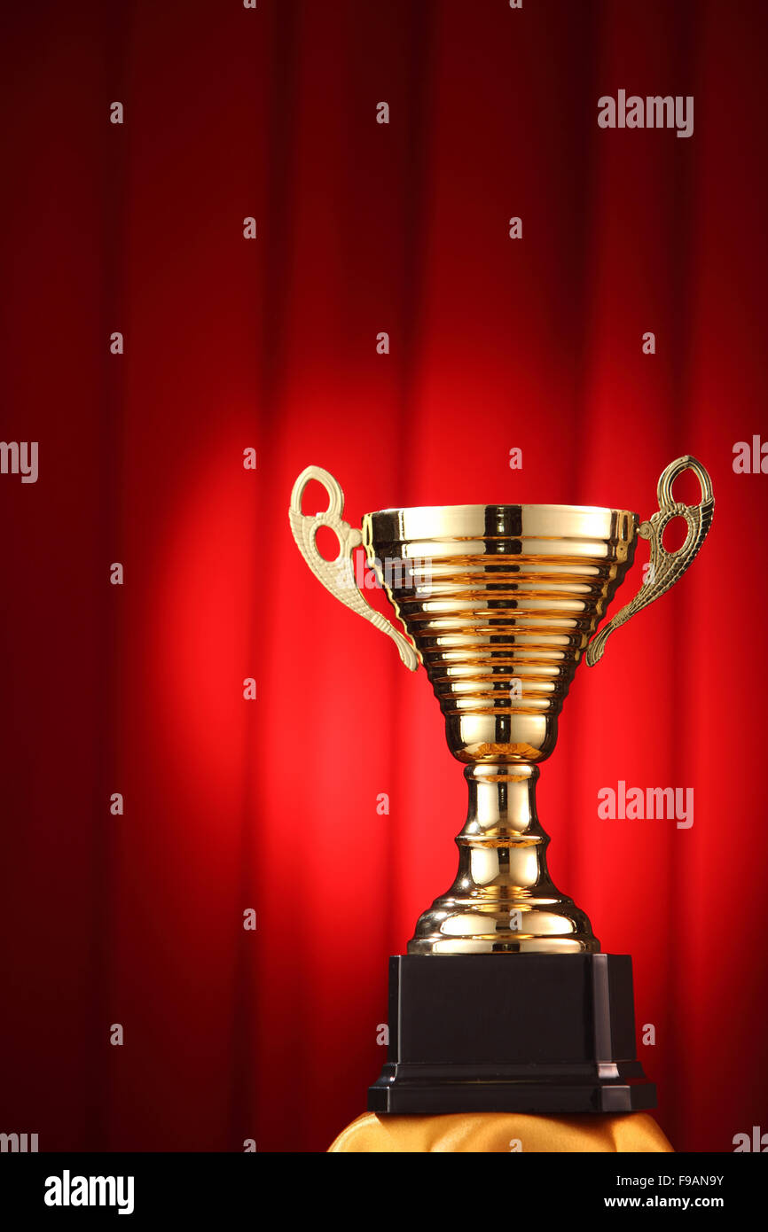 throphy in front of the red curtain Stock Photo - Alamy