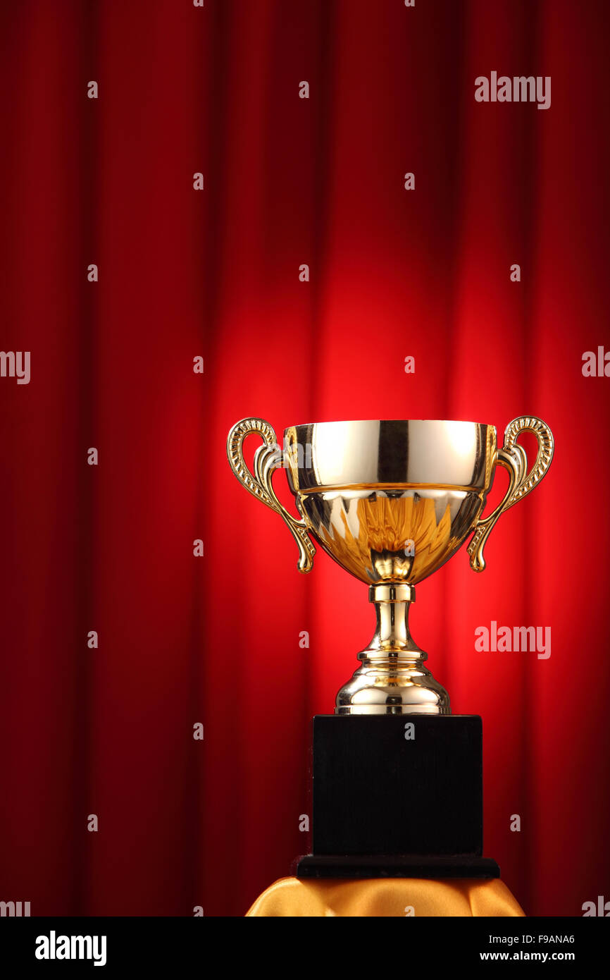 throphy in front of the red curtain Stock Photo - Alamy