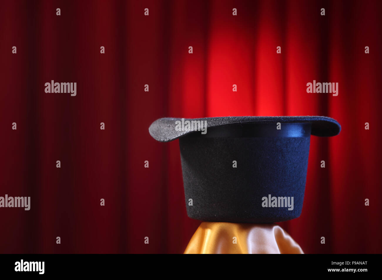 top hat in front of red curtain Stock Photo - Alamy