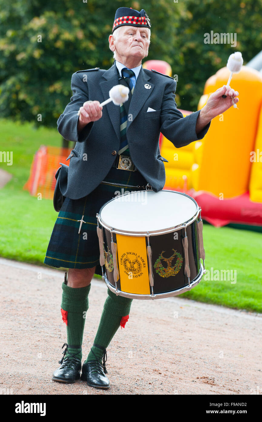 Old man playing Scottish drum outside Crathes Castle in Aberdeenshire ...