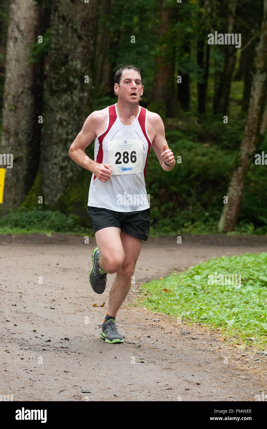 Man running in half marathon at Crathes Castle in Aberdeenshire ...