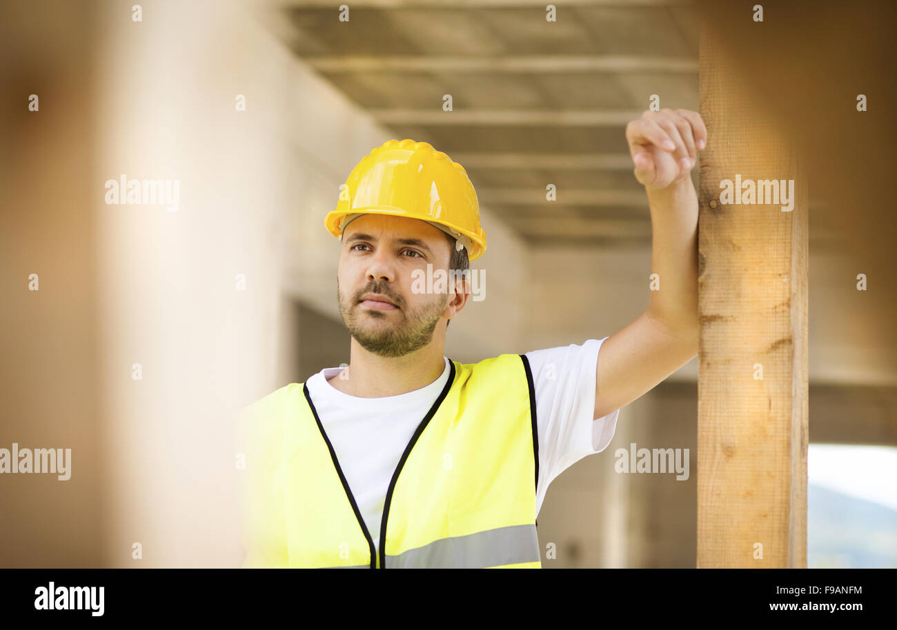 Construction worker is working on new house Stock Photo - Alamy