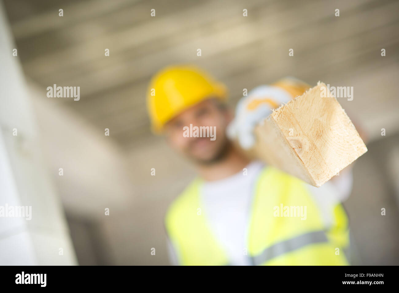Construction worker is working on new house Stock Photo - Alamy