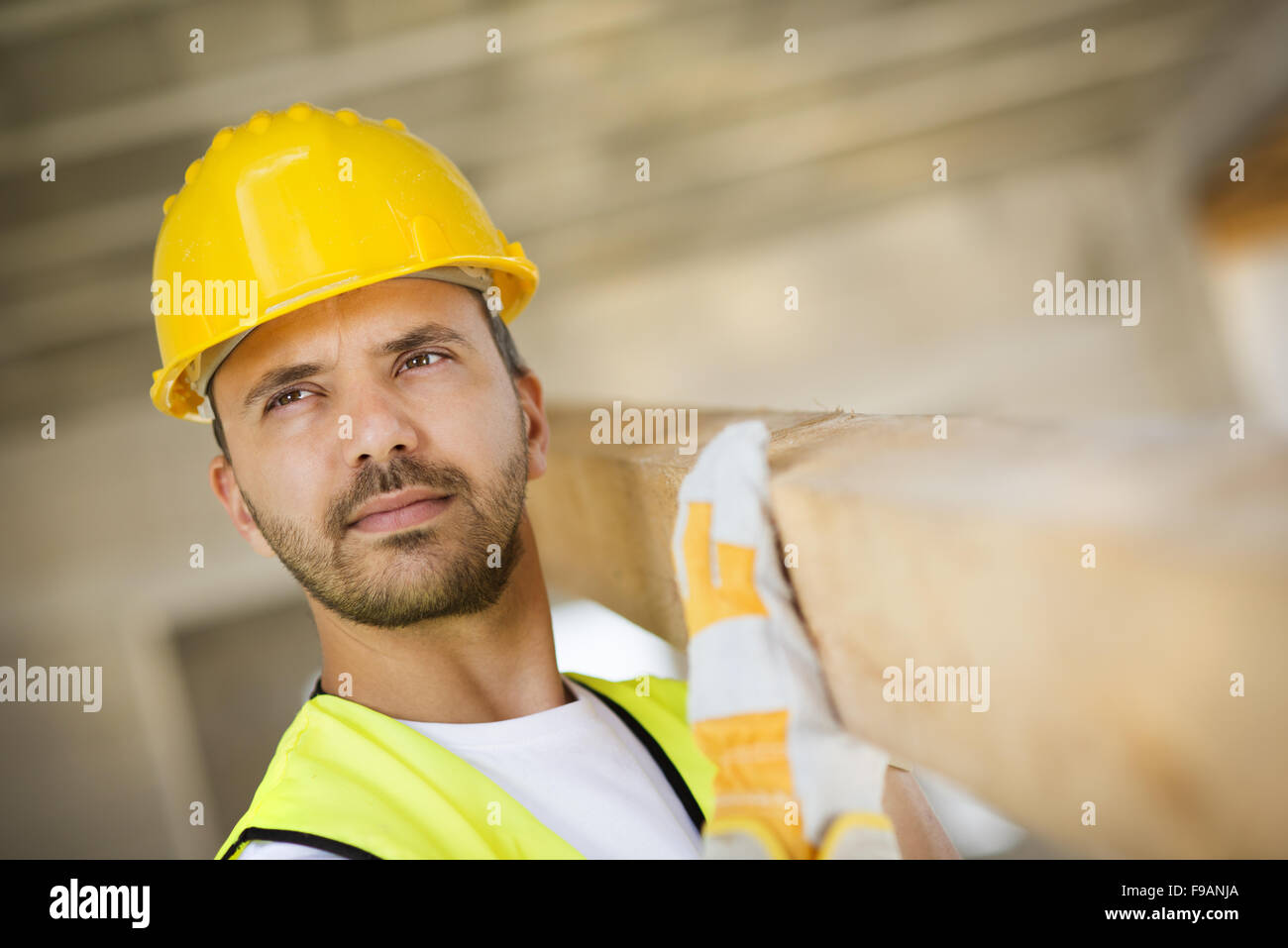 Construction worker is working on new house Stock Photo - Alamy