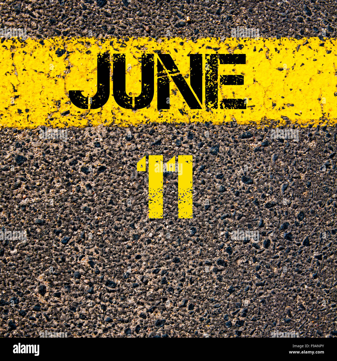 11 June calendar day written over road marking yellow paint line Stock ...