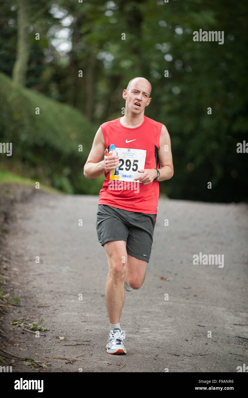 Man running in half marathon at Crathes Castle in Aberdeenshire ...