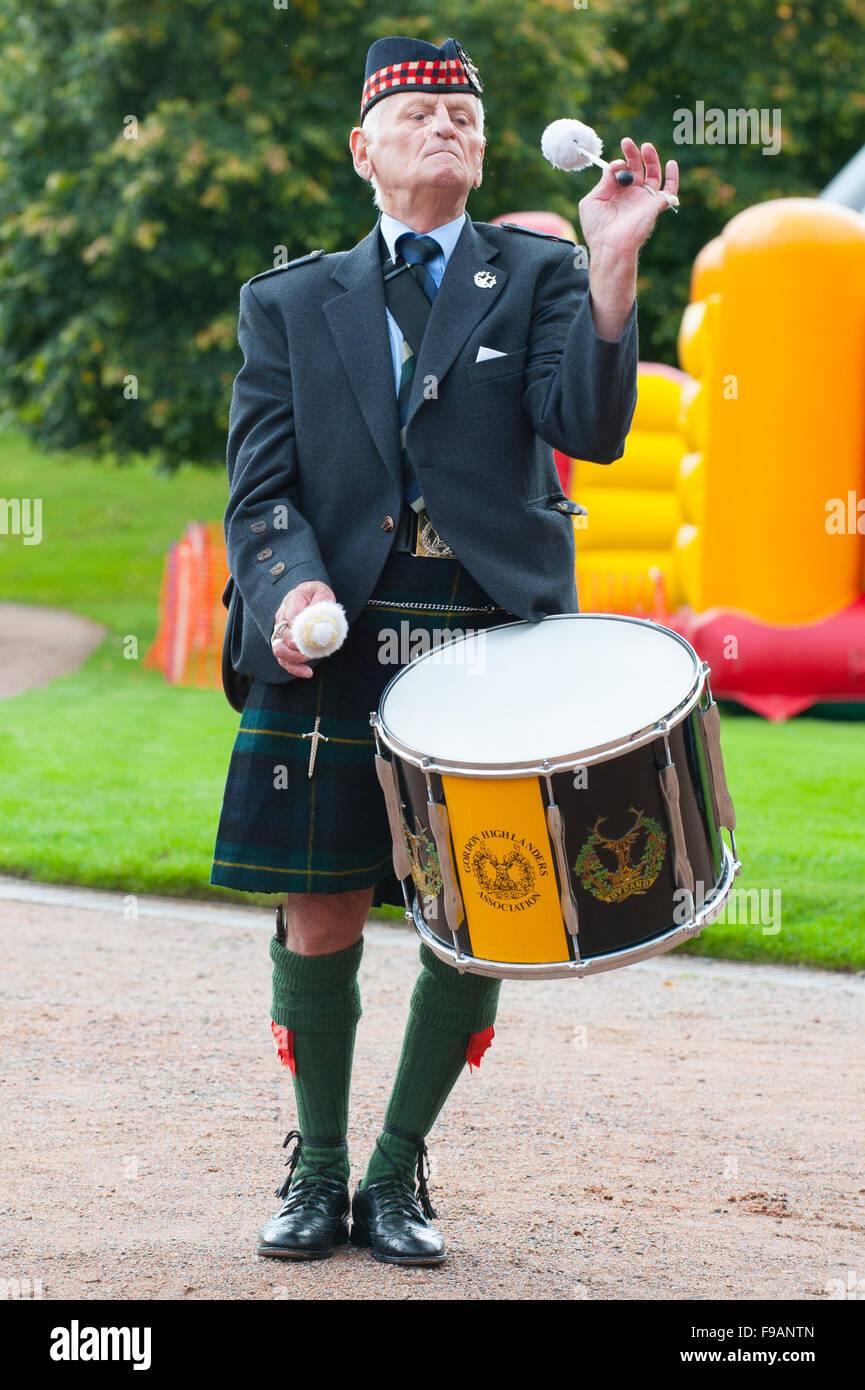 Old man playing Scottish drum outside Crathes Castle in Aberdeenshire ...