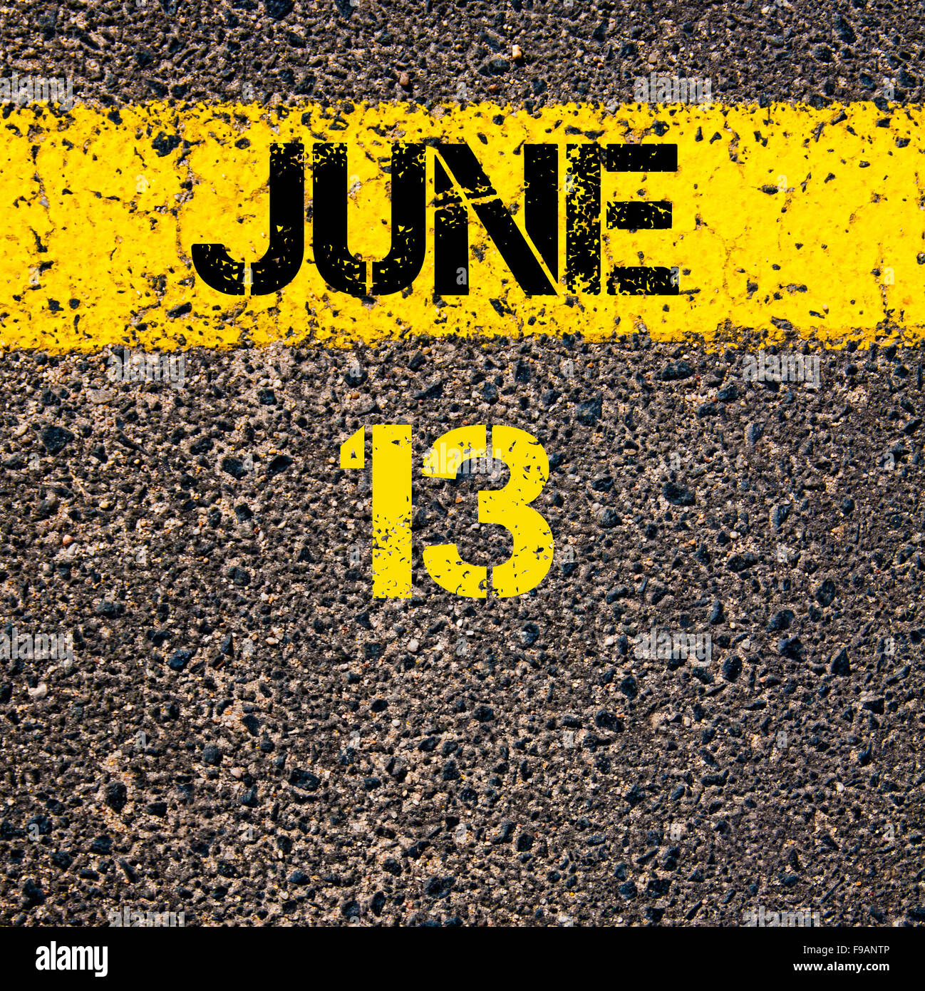 13 June calendar day written over road marking yellow paint line Stock ...