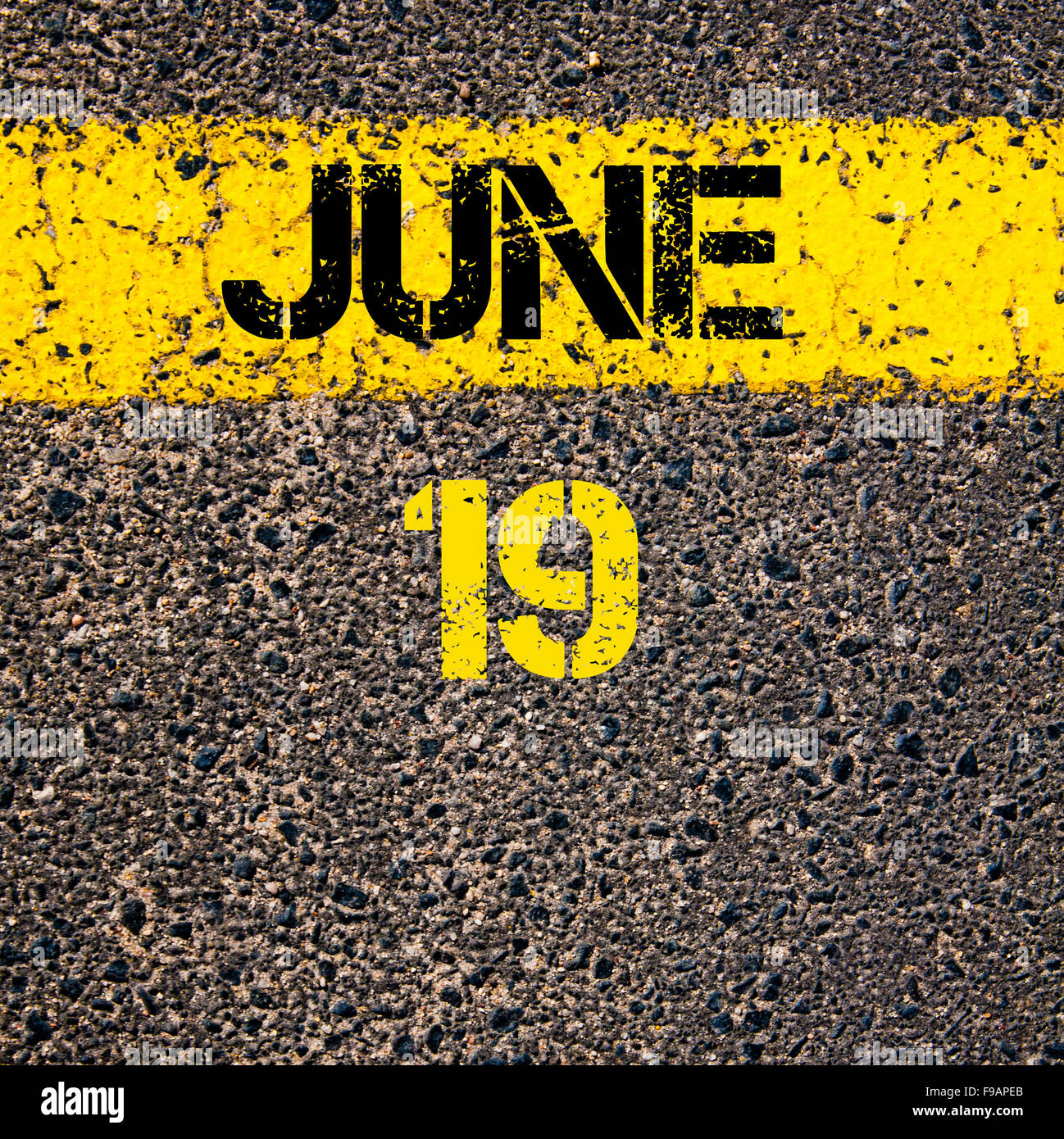 19 June calendar day written over road marking yellow paint line Stock ...