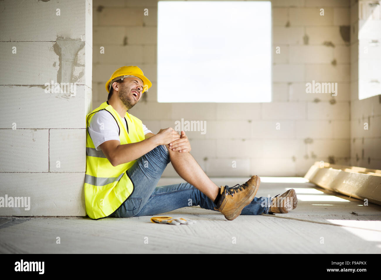 Construction worker has an accident while working on new house Stock ...