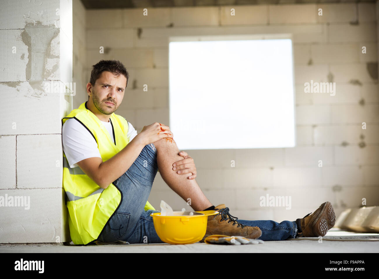 Construction worker has an accident while working on new house Stock ...
