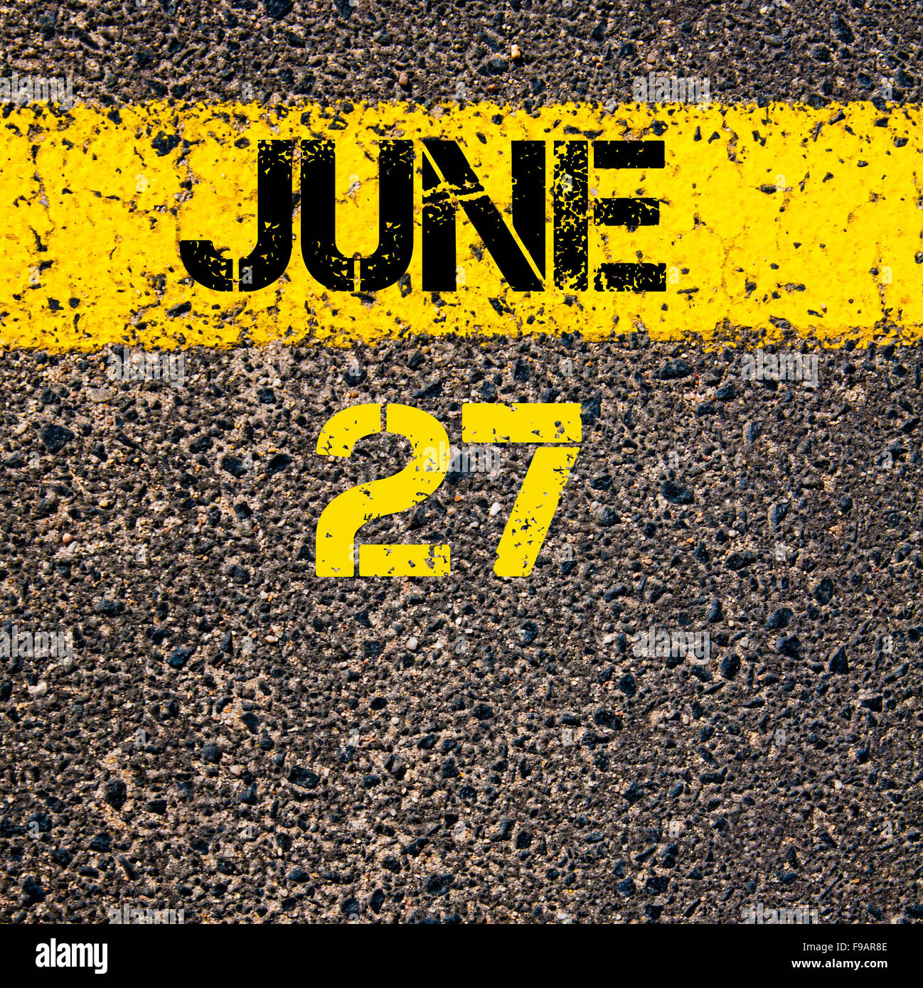 27 June calendar day written over road marking yellow paint line Stock ...