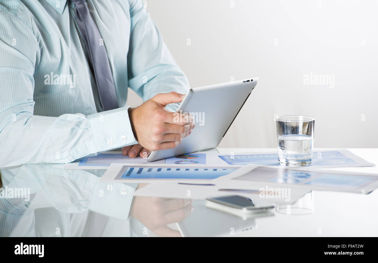 Business people reading graphs and charts Stock Photo - Alamy
