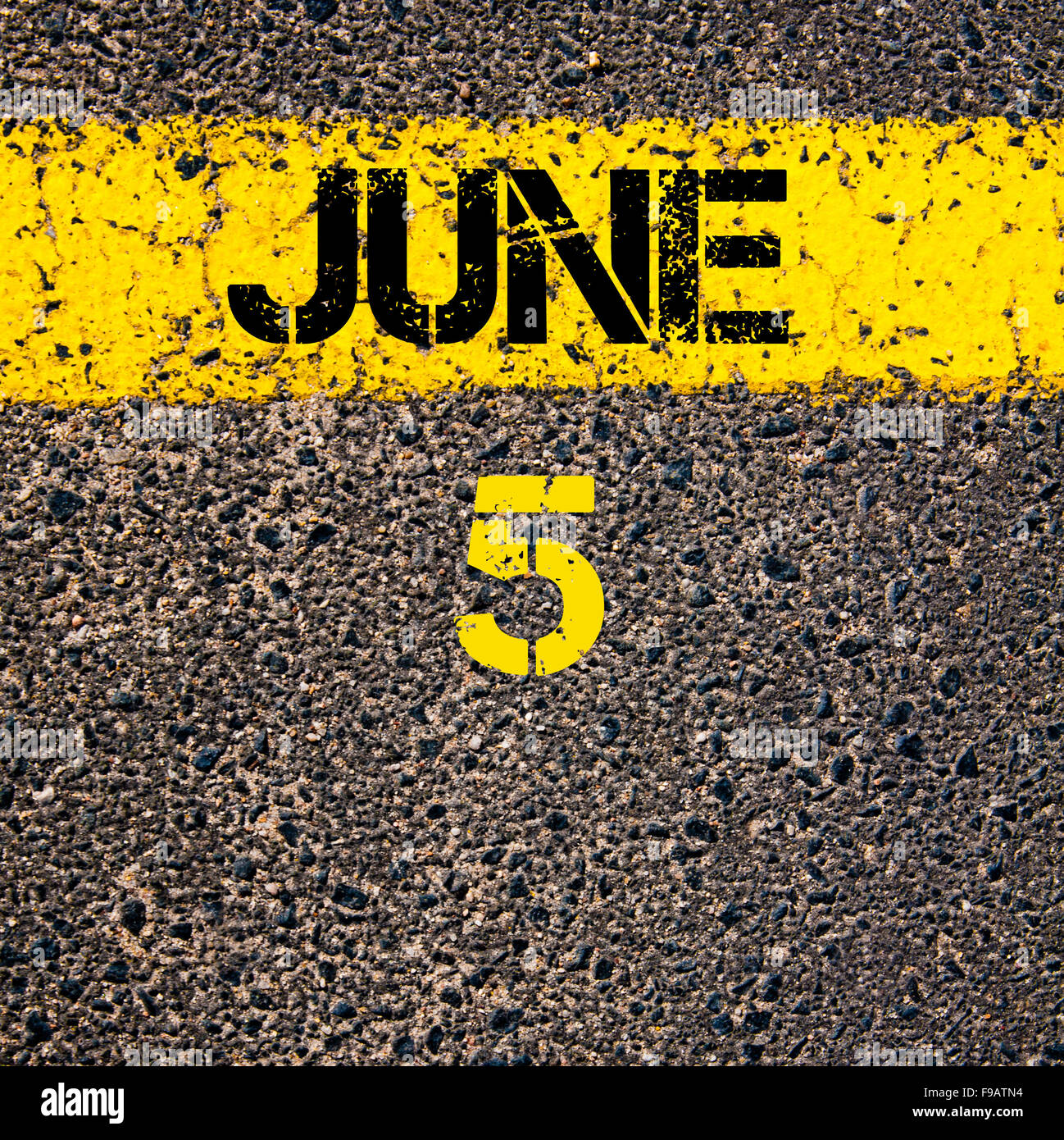 5 June calendar day written over road marking yellow paint line Stock ...