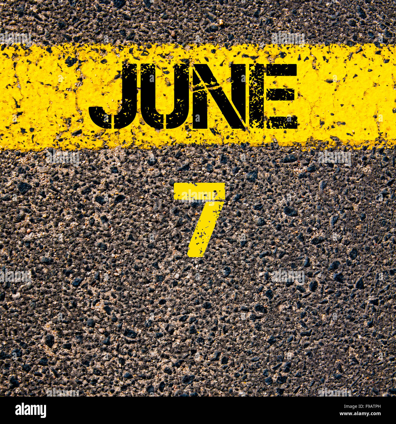 7 June calendar day written over road marking yellow paint line Stock ...