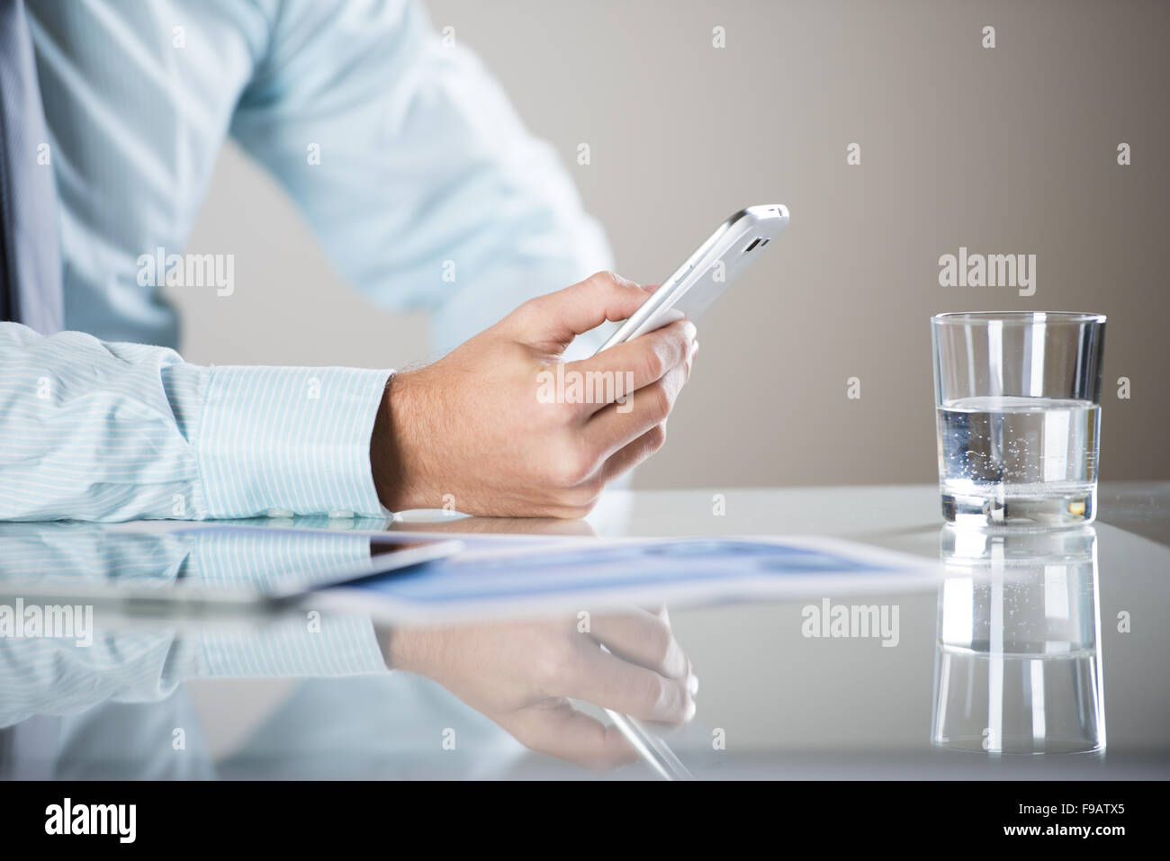 Businessman uses the new media technologies and devices to work ...