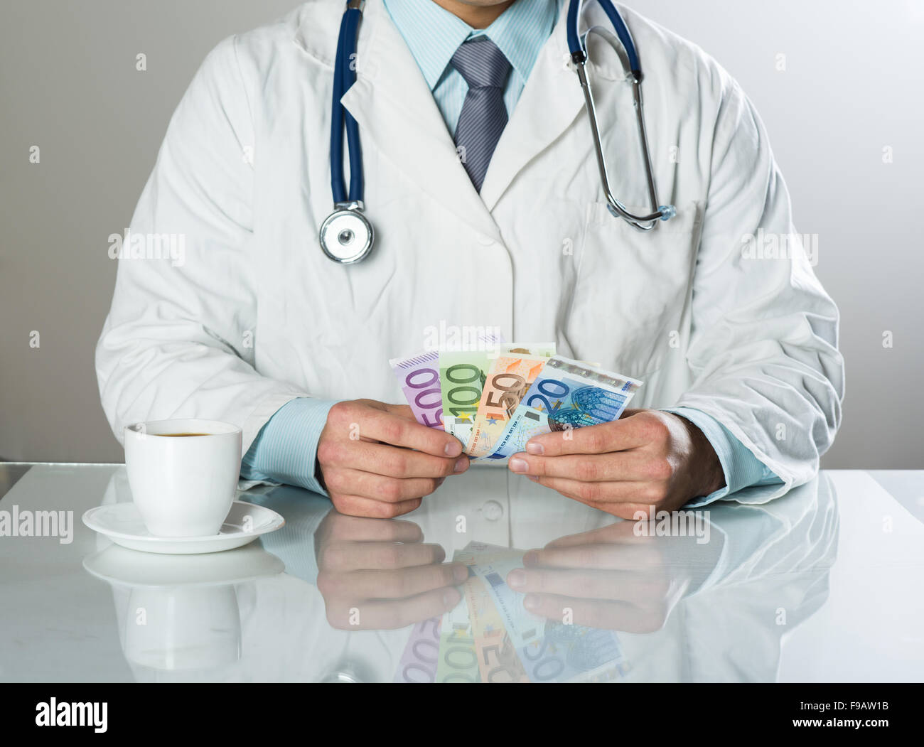 Closeup on medical doctor hands, taking money Stock Photo - Alamy