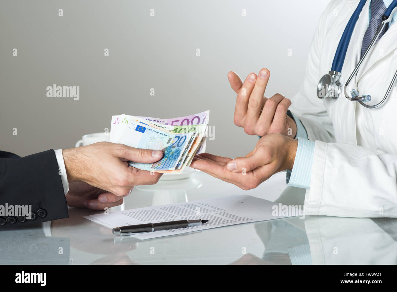 Corrupt doctor taking bribe hi-res stock photography and images - Alamy
