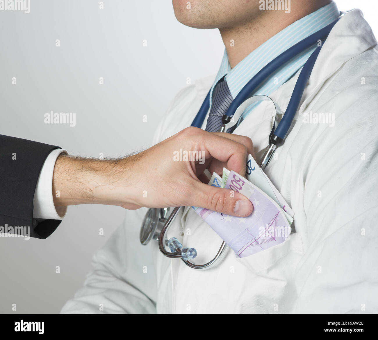 Closeup on medical doctor hands, taking money Stock Photo - Alamy