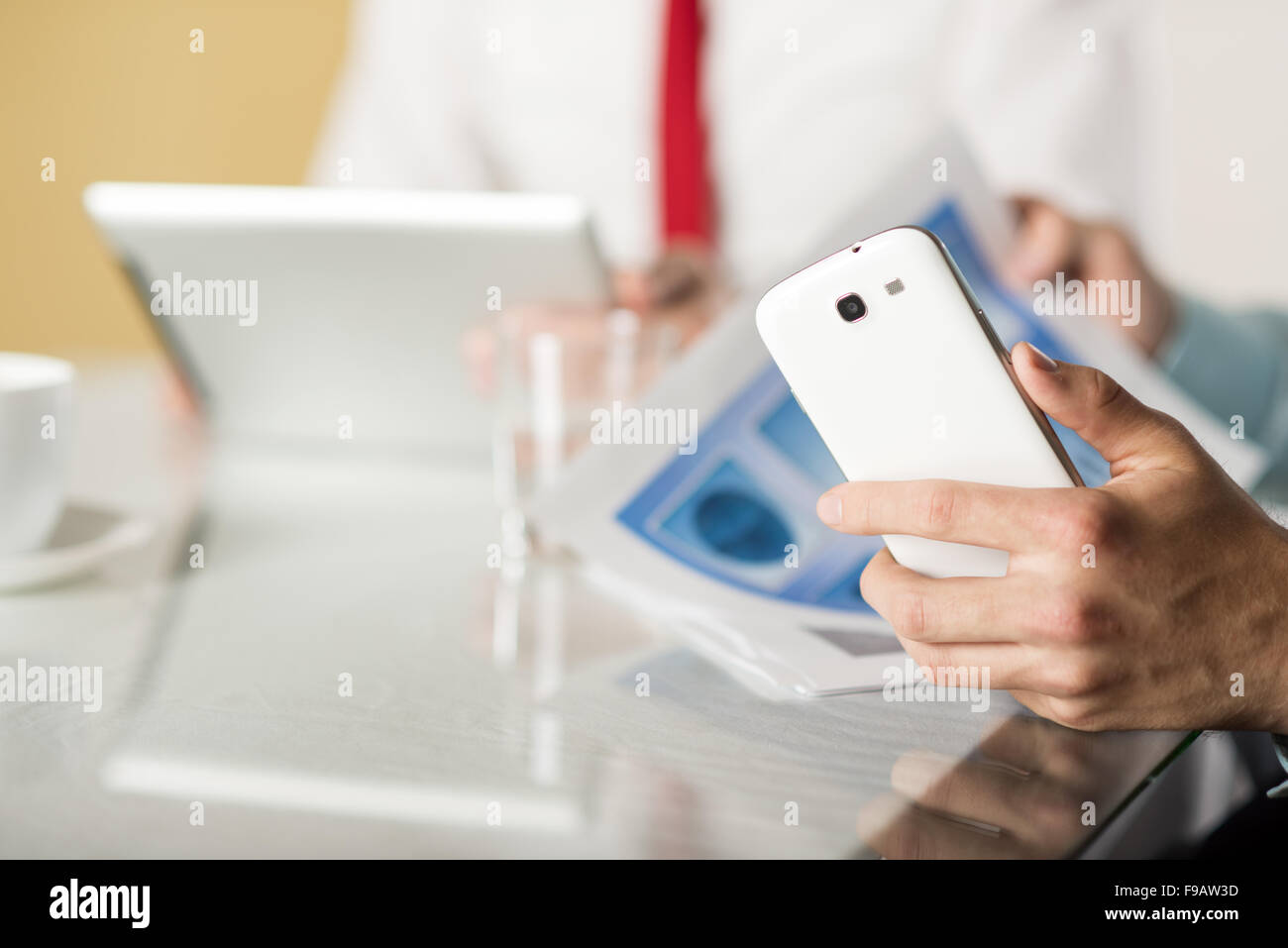 Business people reading graphs and charts Stock Photo - Alamy