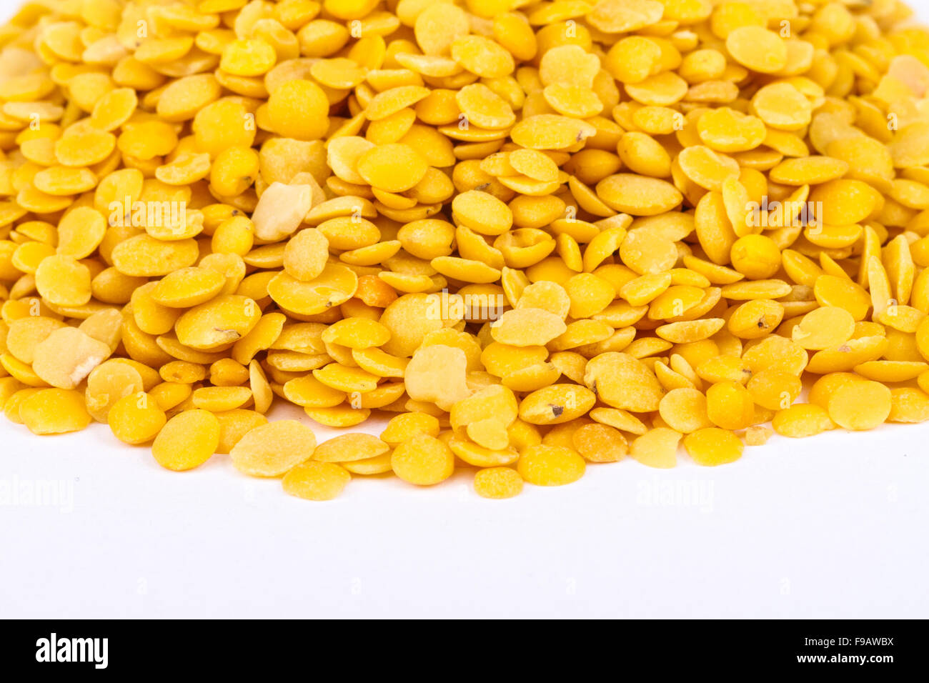 Yellow lentils isolated on white background.Macro shot Stock Photo - Alamy