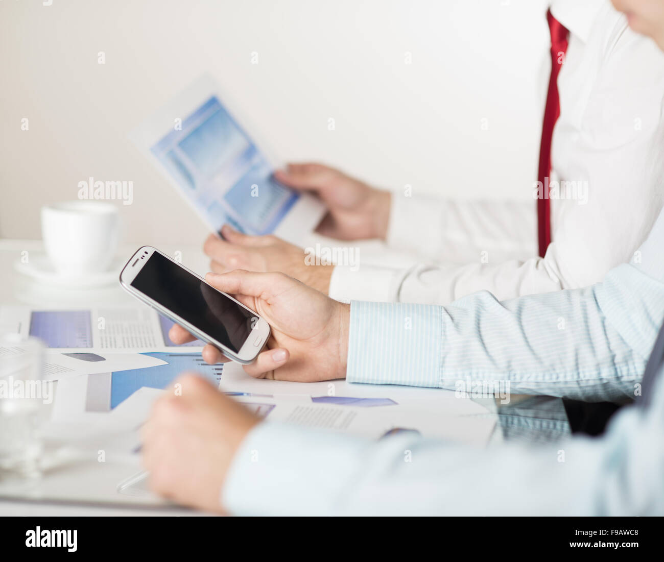 Business people reading graphs and charts Stock Photo - Alamy