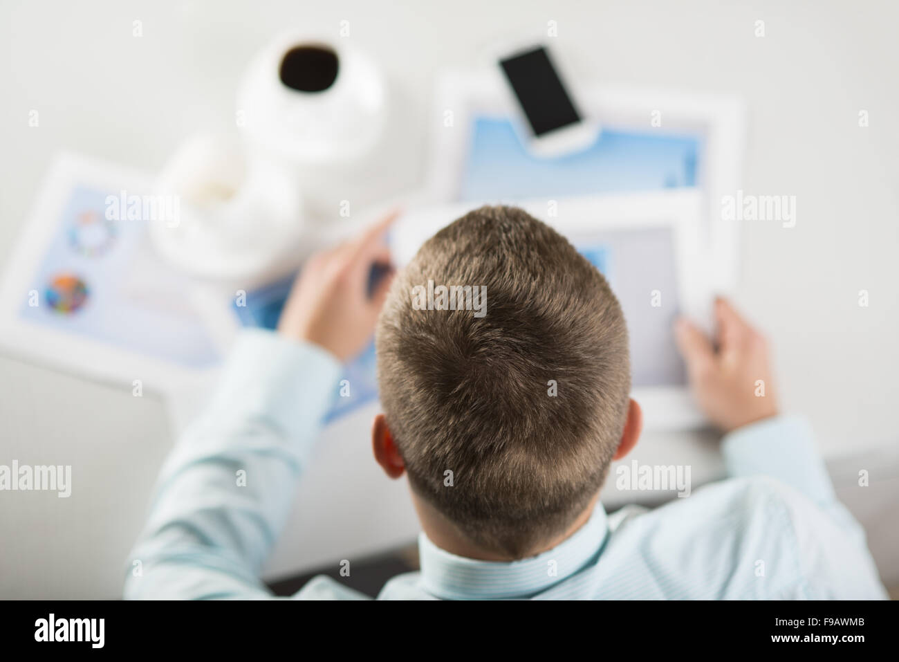 Business people reading graphs and charts Stock Photo - Alamy