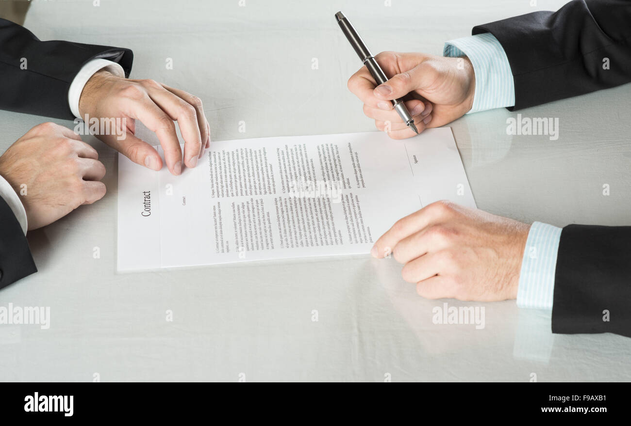 Businessmen are signing a contract, business contract details Stock ...