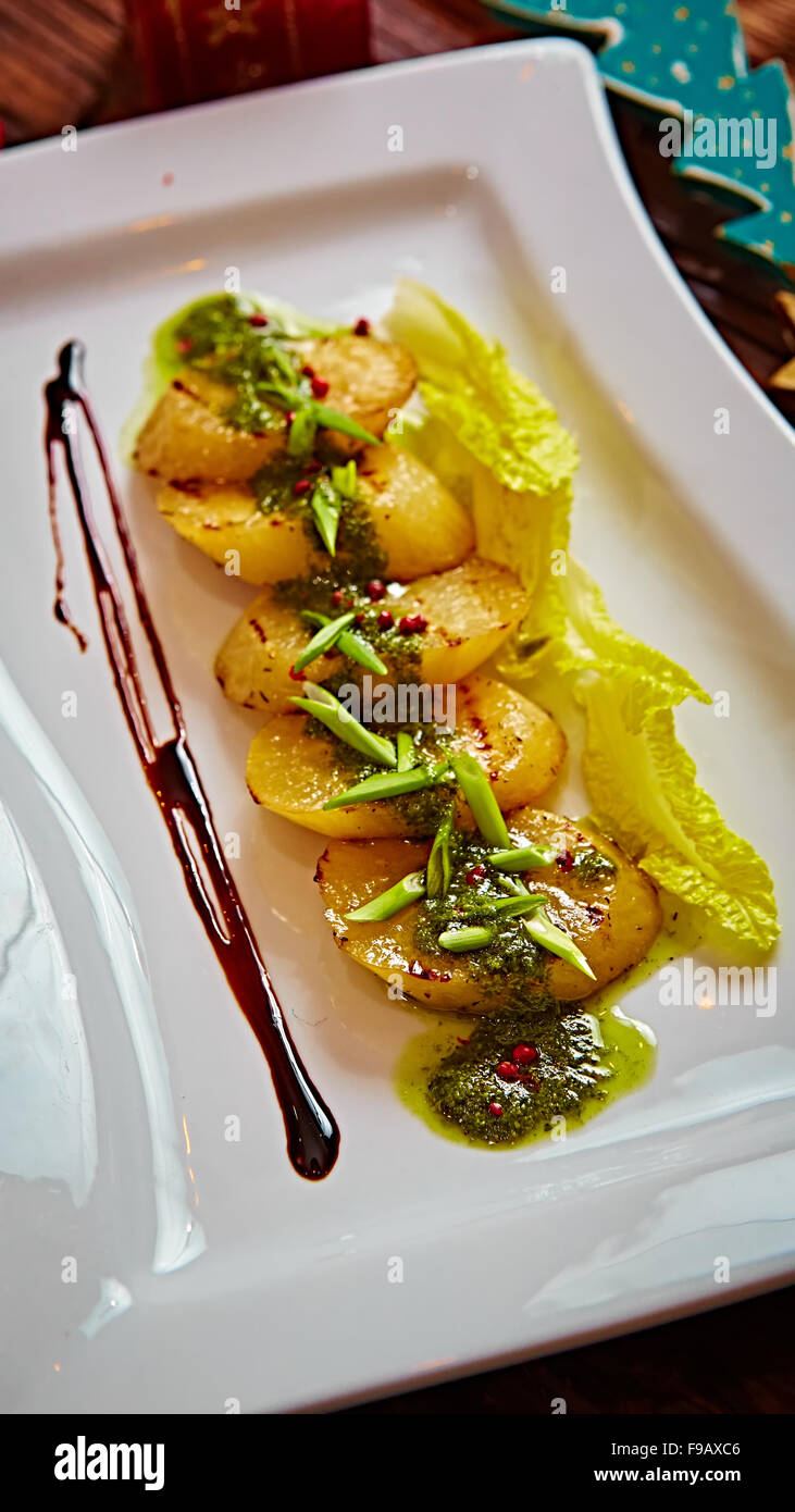appetizer of grilled celery with greens Stock Photo - Alamy