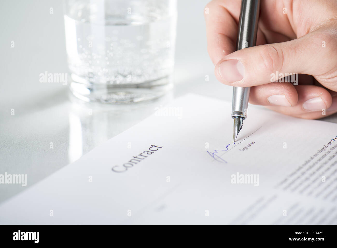 Businessman is signing a contract, business contract details Stock ...