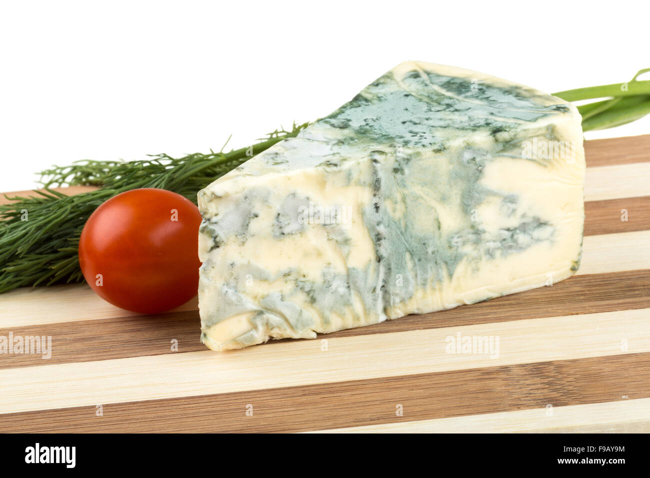 Wedge of soft blue cheese, isolated on white Stock Photo - Alamy