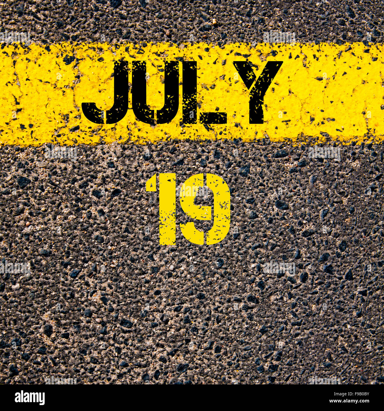 19 July calendar day written over road marking yellow paint line Stock ...