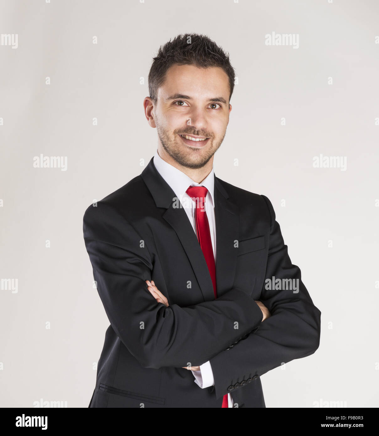 Successful business man is standing on isolated white background Stock ...