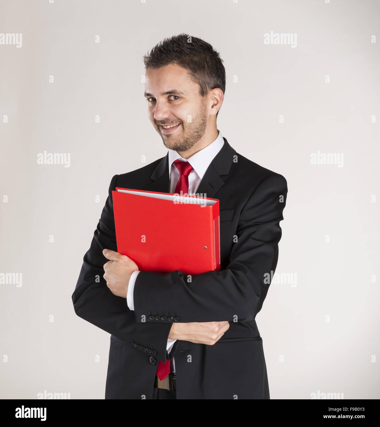 Successful business man is standing on isolated white background Stock ...