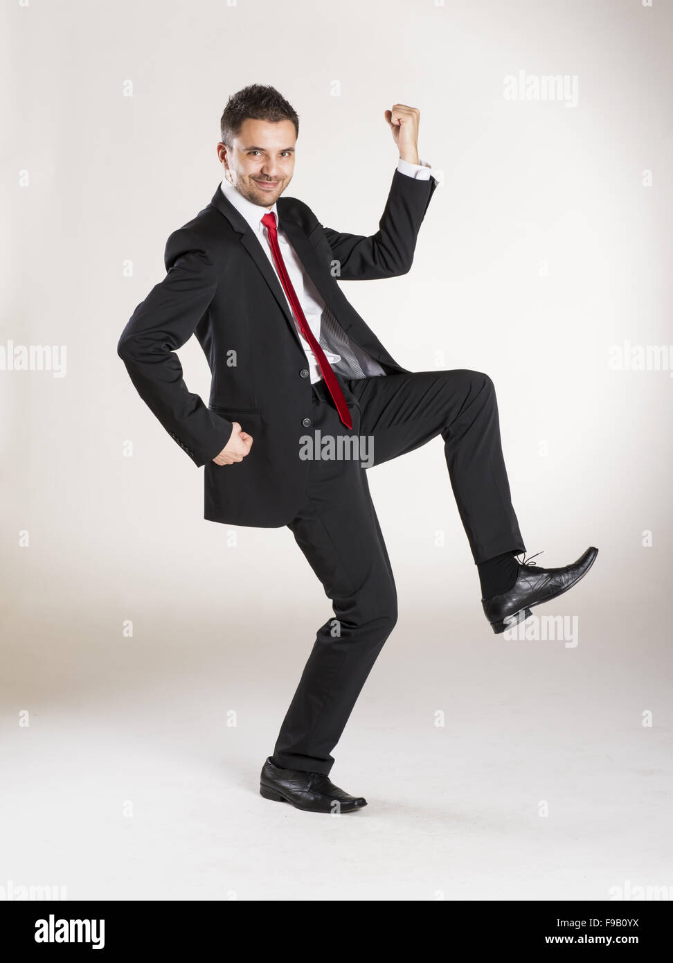 Successful business man is standing on isolated white background Stock ...