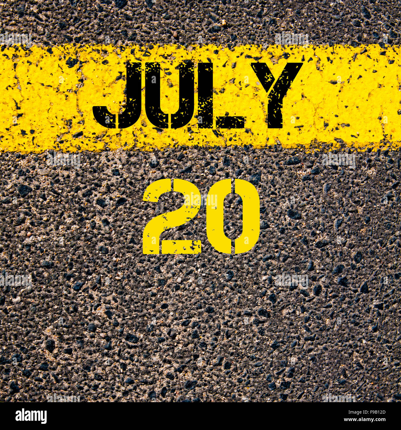 20 July calendar day written over road marking yellow paint line Stock ...