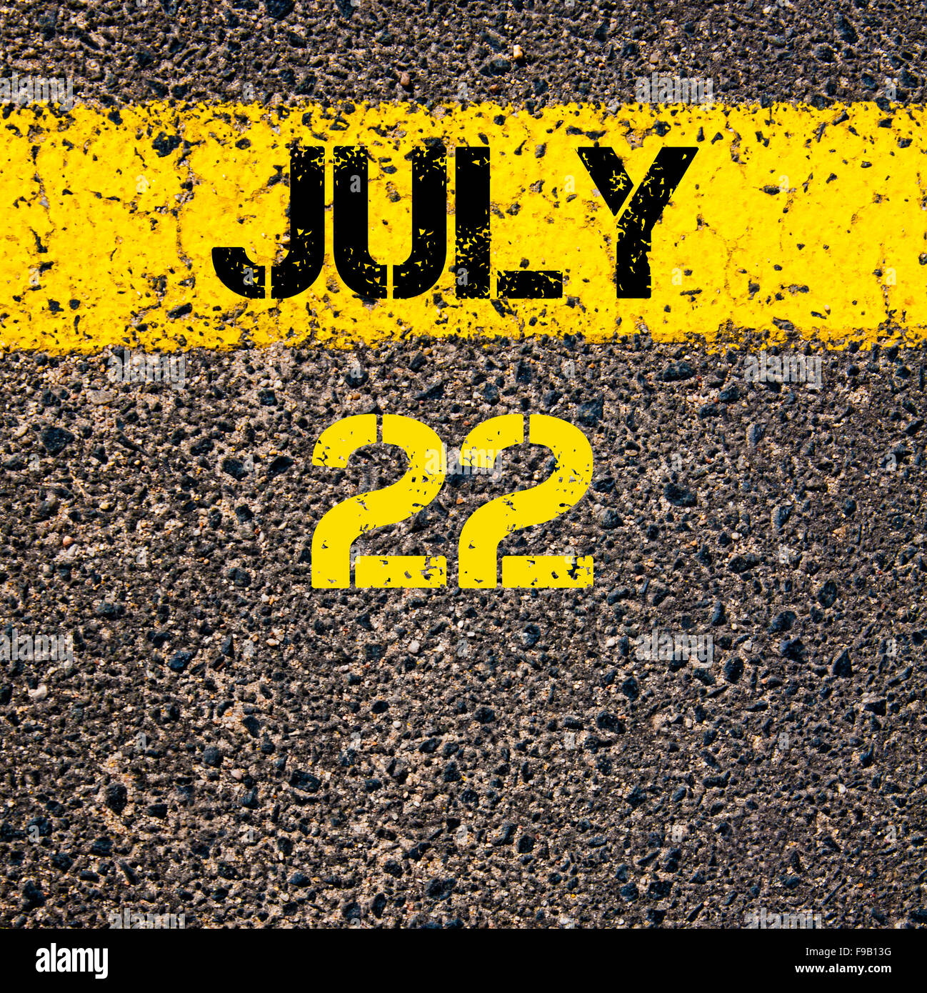 22 July calendar day written over road marking yellow paint line Stock ...