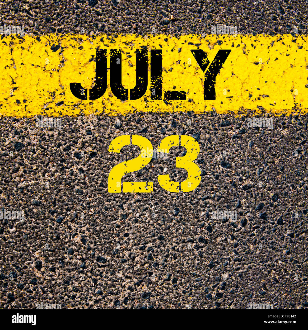 23 July calendar day written over road marking yellow paint line Stock ...