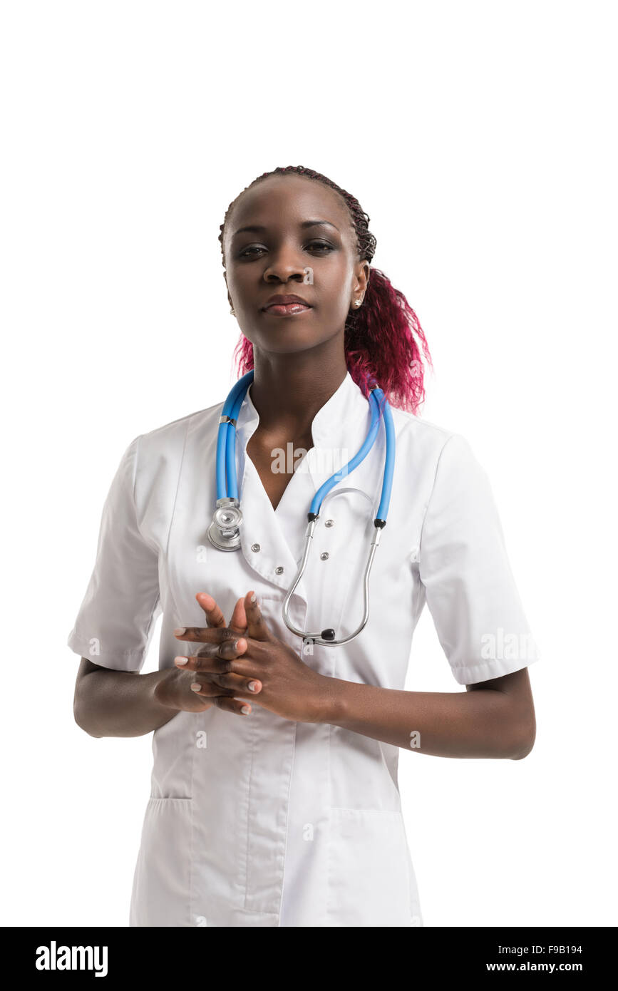 Pretty young female african doctor posing seriously Stock Photo - Alamy