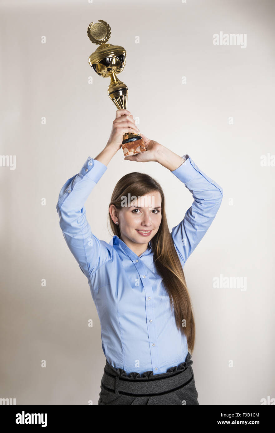 Portrait of successful business woman with trophy Stock Photo - Alamy