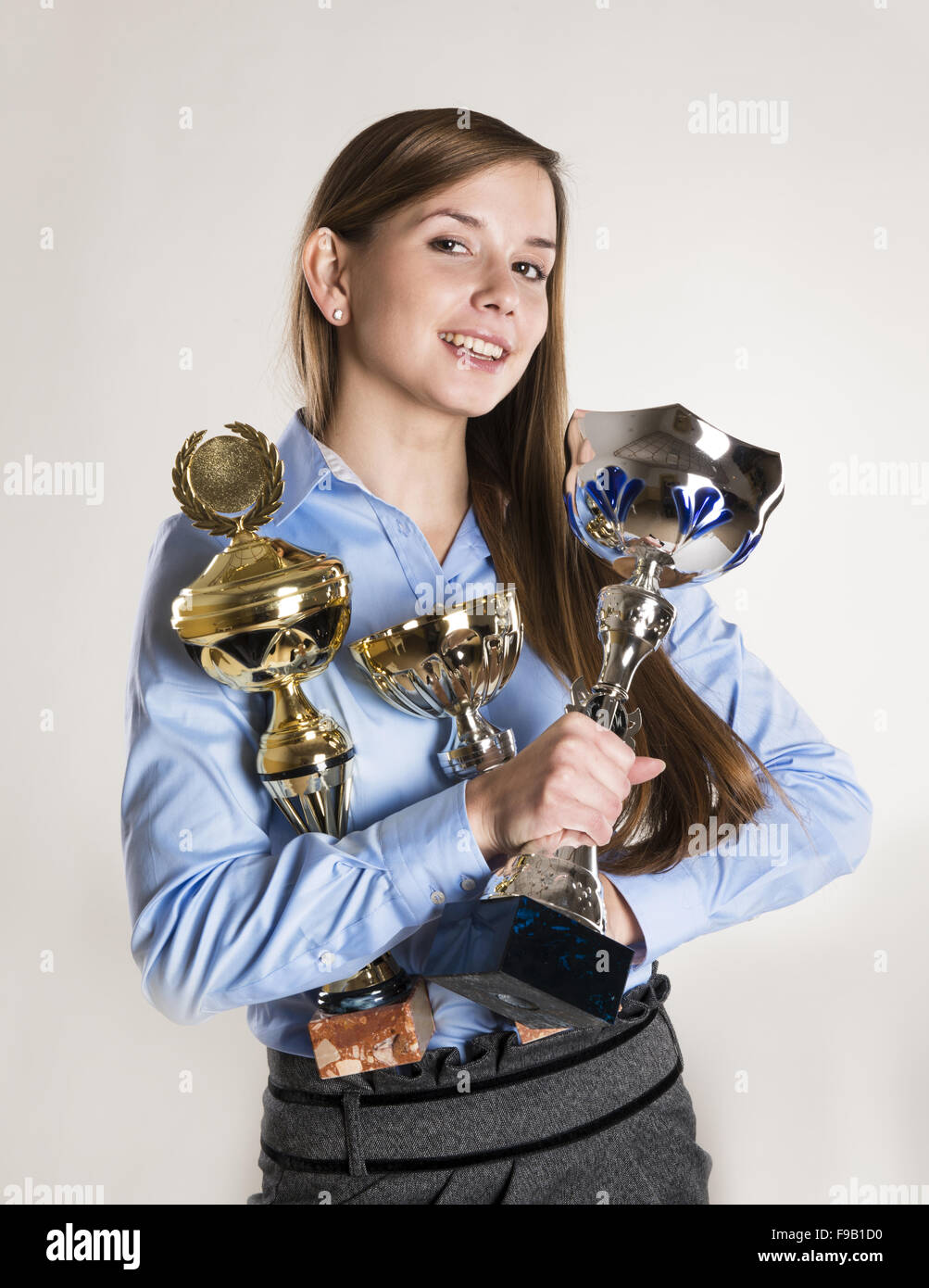 Portrait of successful business woman with trophy Stock Photo - Alamy
