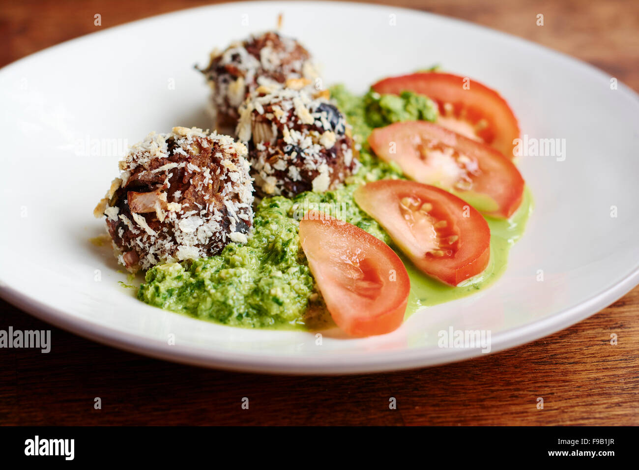 Eggplant Balls with Kale Pesto Stock Photo - Alamy