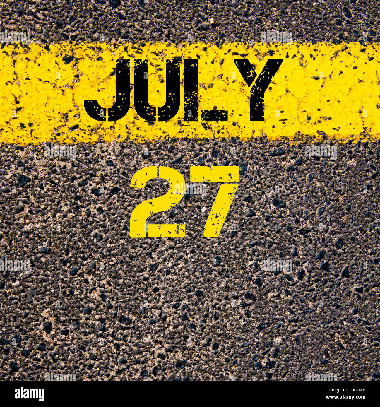 27 July calendar day written over road marking yellow paint line Stock ...