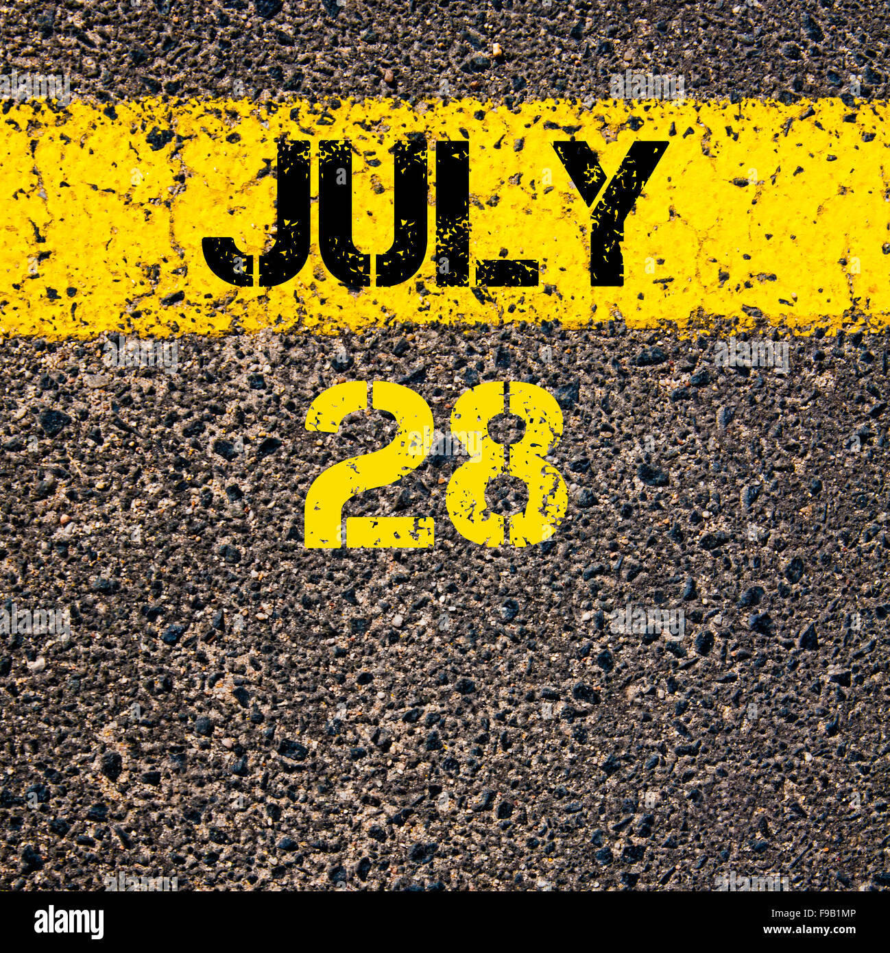 28 July calendar day written over road marking yellow paint line Stock ...