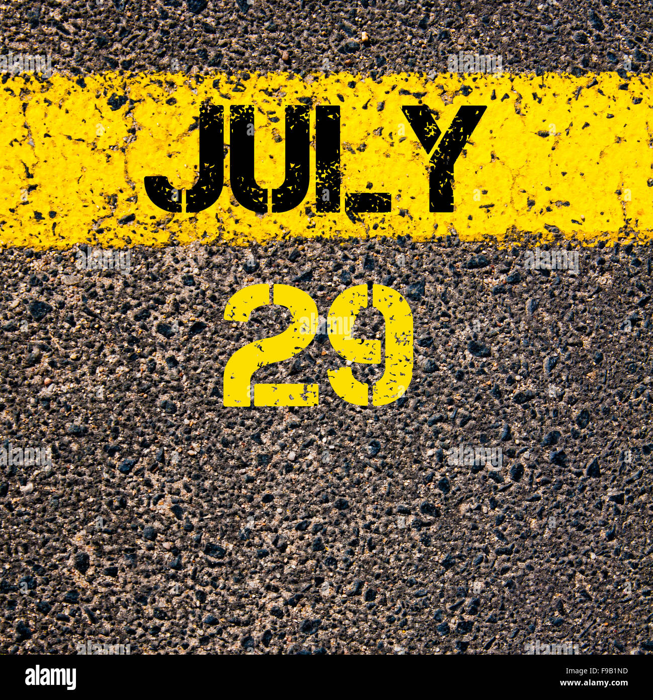 29 July calendar day written over road marking yellow paint line Stock ...