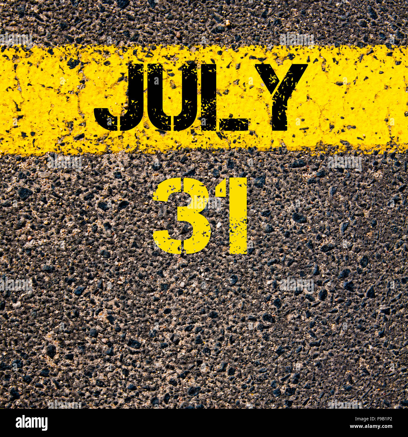31 July calendar day written over road marking yellow paint line Stock ...