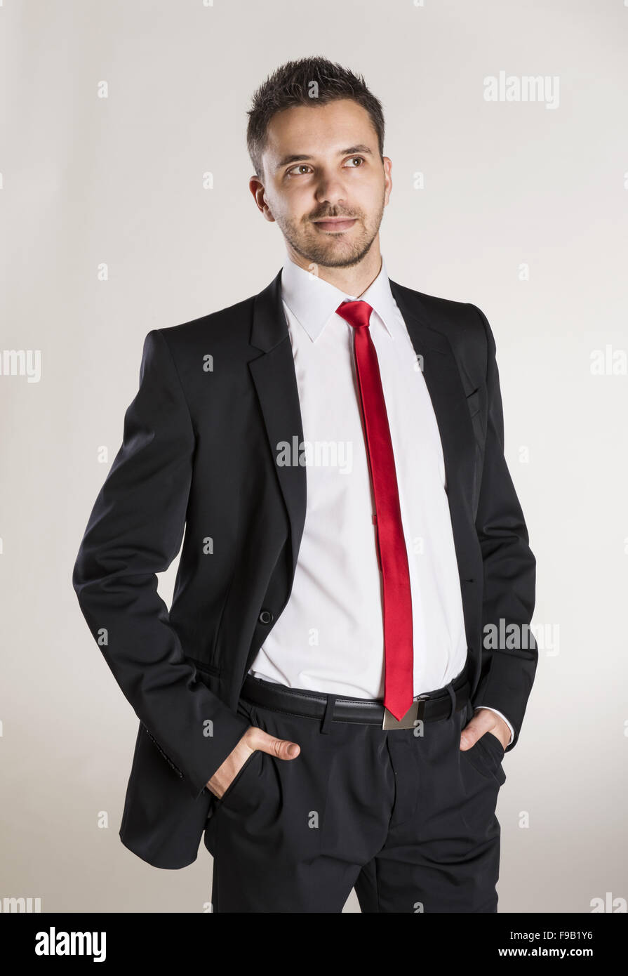 Successful business man is standing on isolated white background Stock ...
